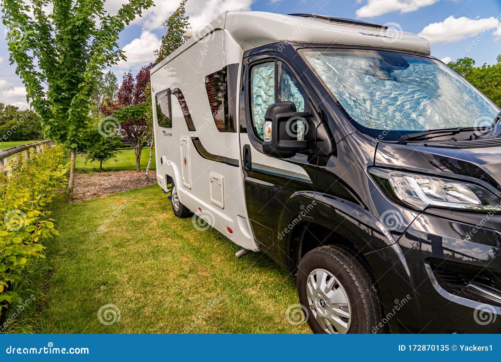 Front End and Side View of a Small Motor Home in the Countryside ...