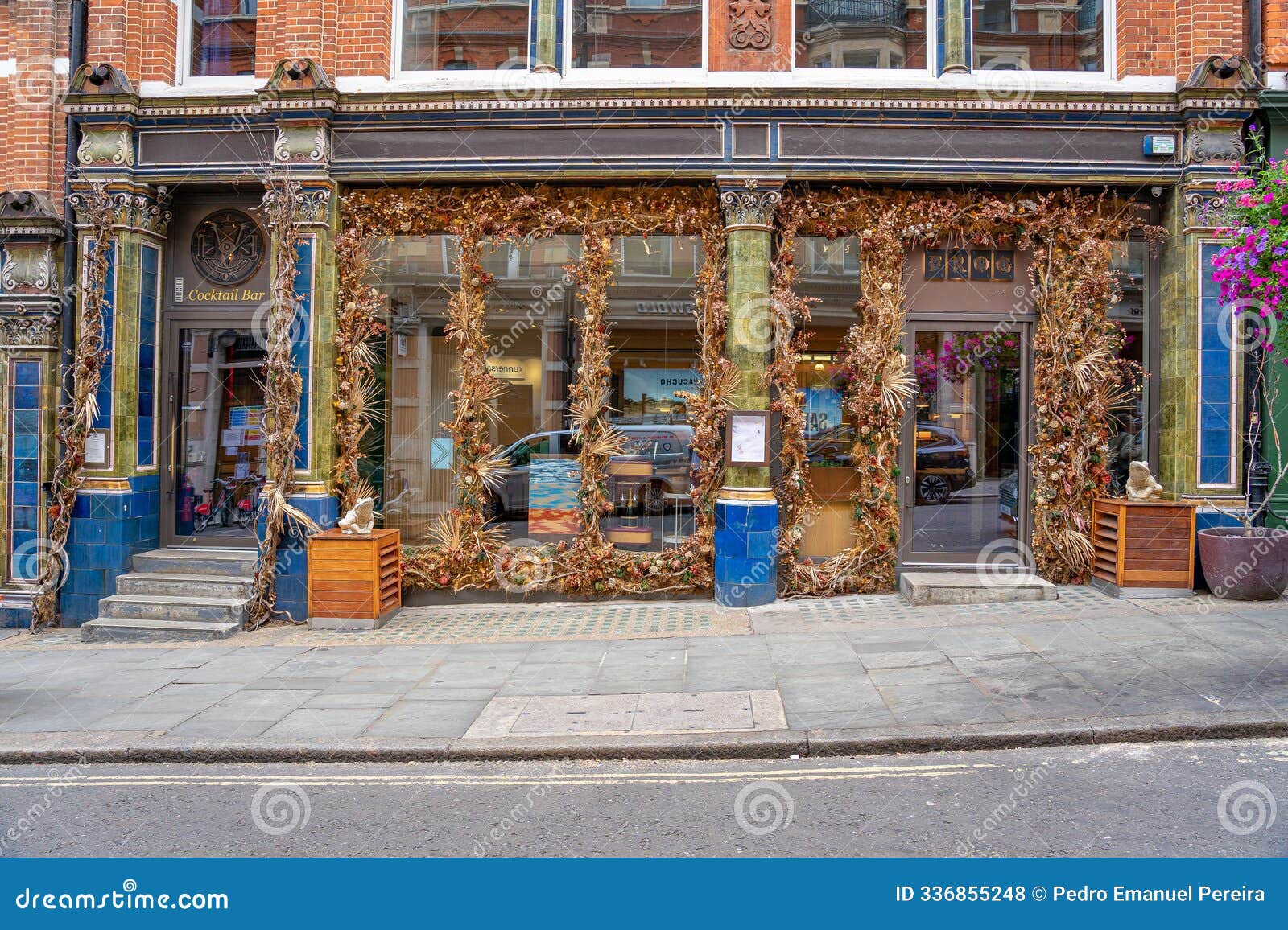 Front Facade of the Frog Bar during the Day in Central London Editorial ...
