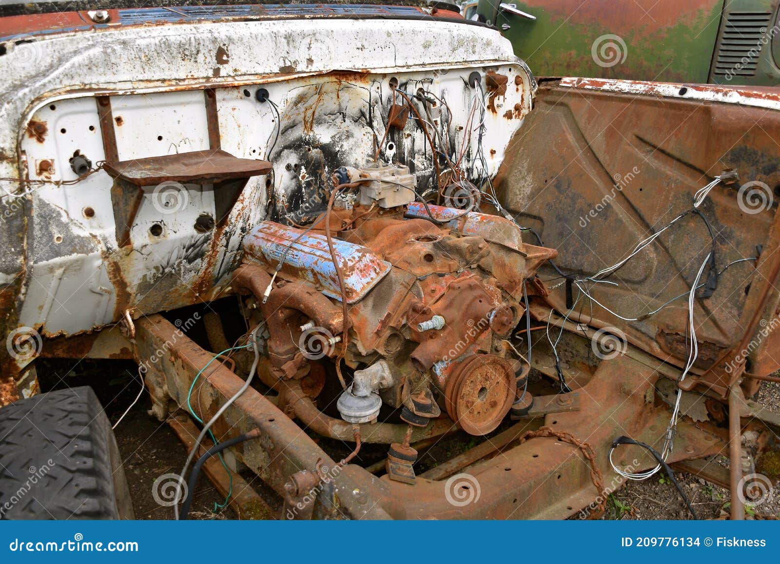 An Old Pickup Exposes the Front Half of a Chassis, Engine, and the ...