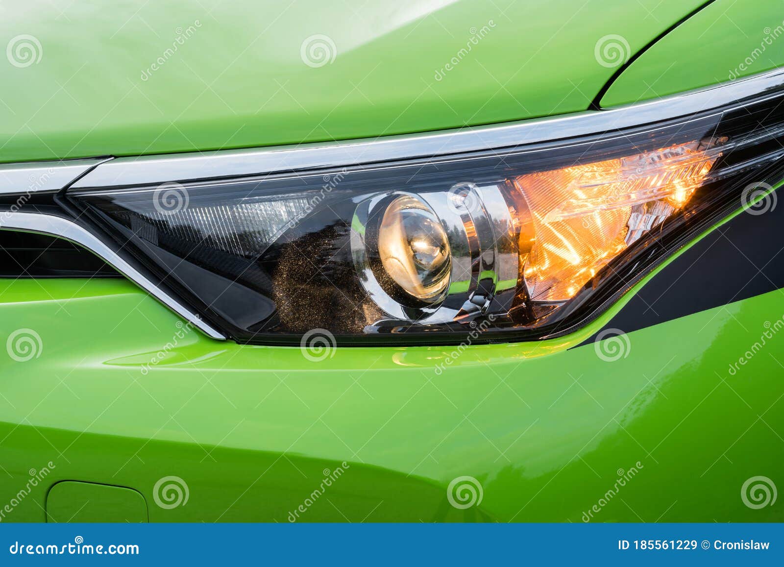 Front Headlight on a Modern Green Car Stock Image - Image of chrome ...
