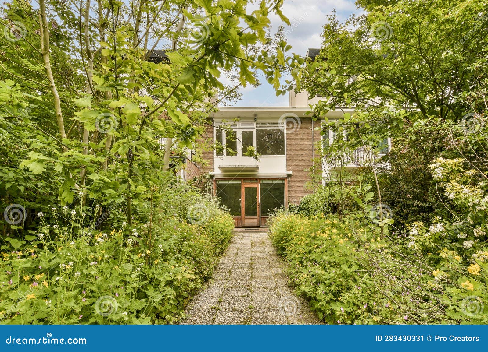 The Front of a House with a Pathway and Trees Stock Image - Image of ...