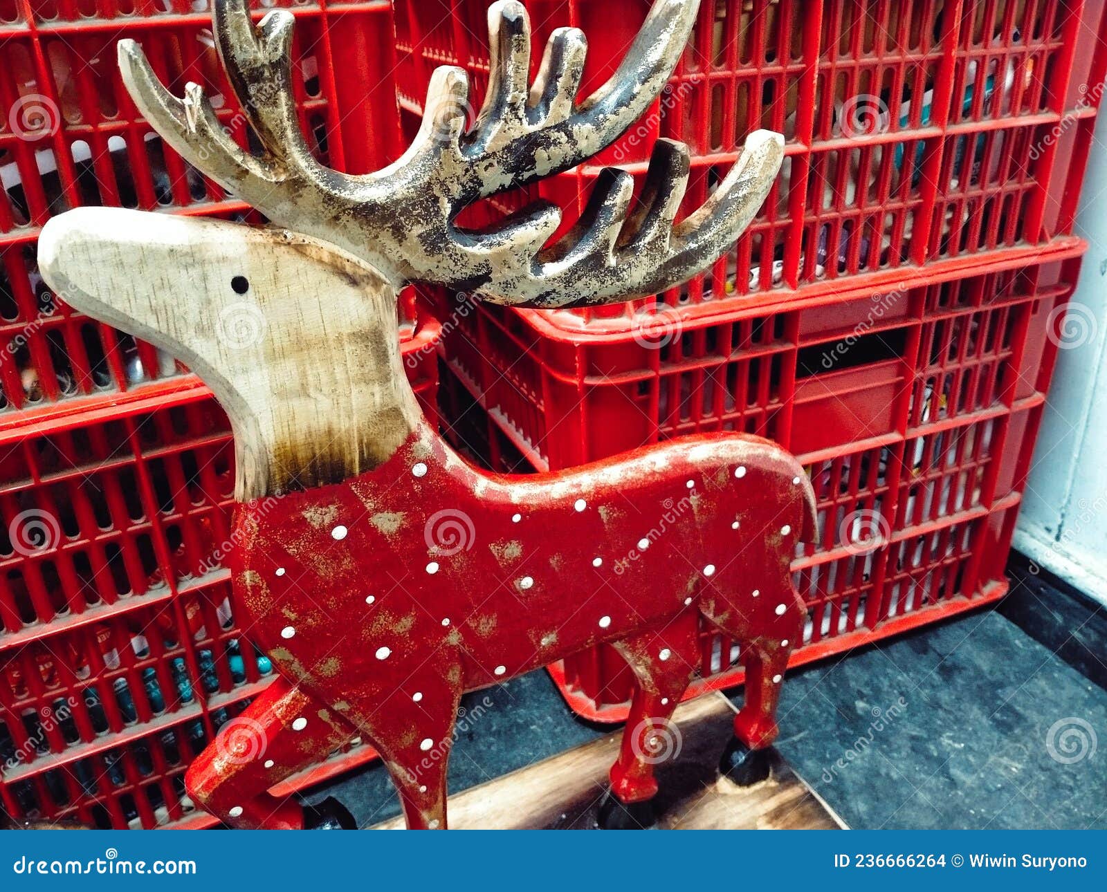 The Front Left Side View of the Red Wooden Reindeer is Standing on the ...