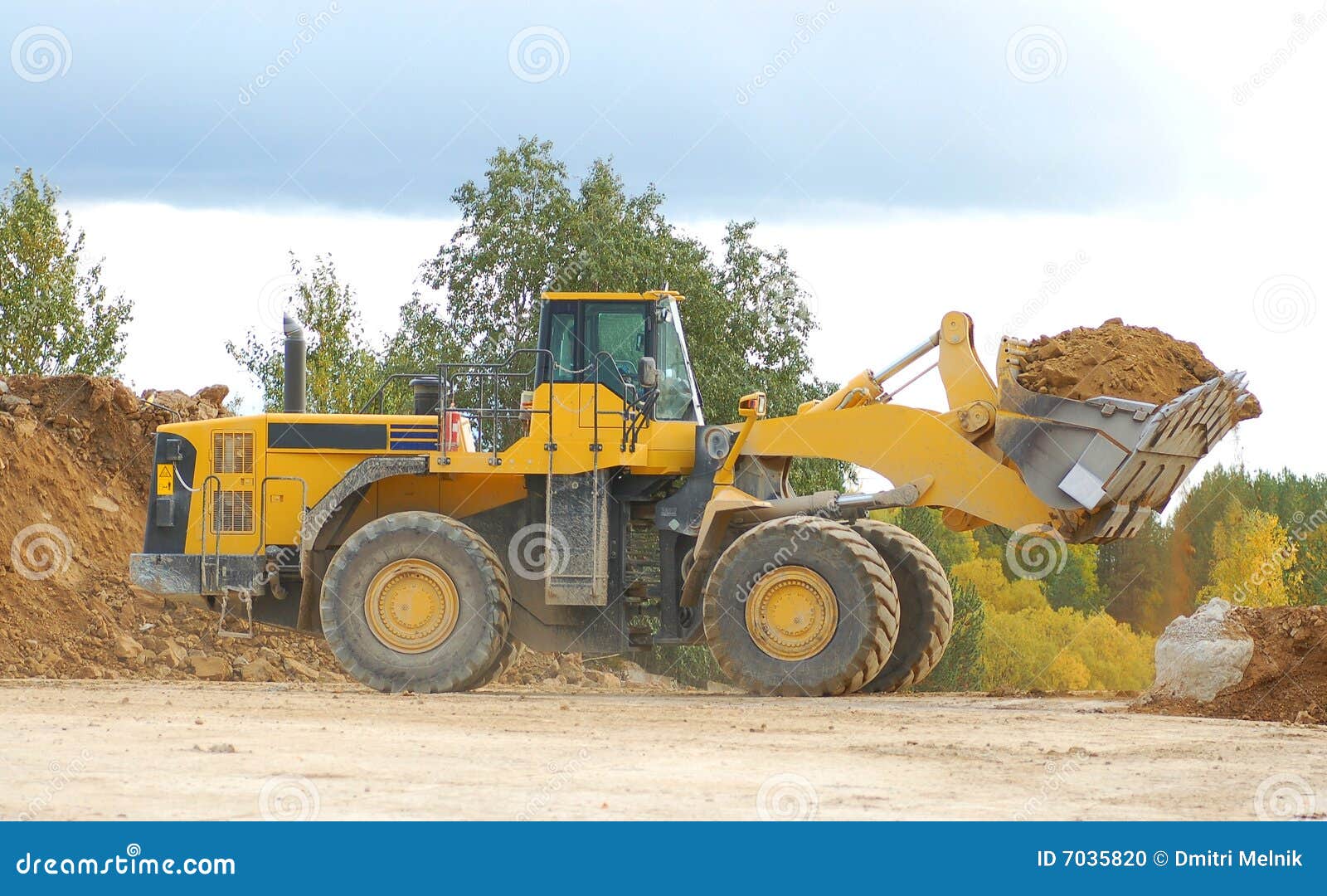 Front loader in action stock photo. Image of lift, loading - 7035820