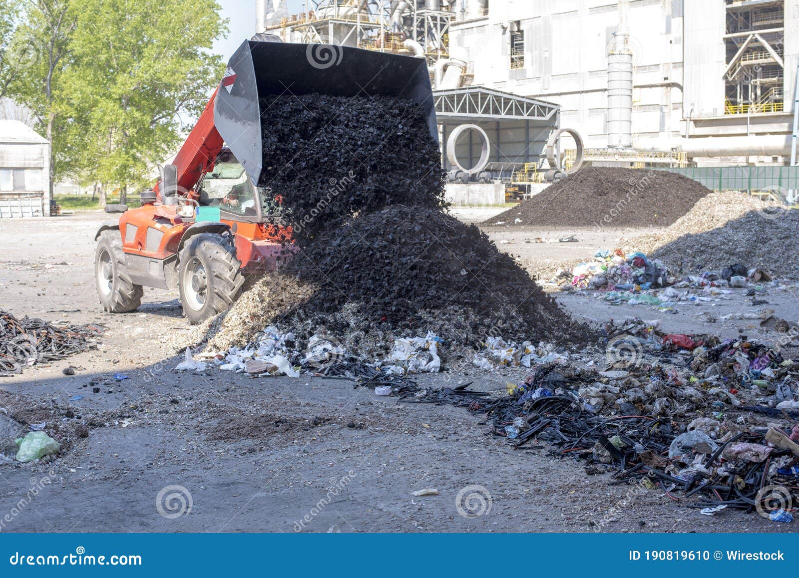 Front Loader Dumping Waste Materials at a Waste Treatment Plant Stock ...