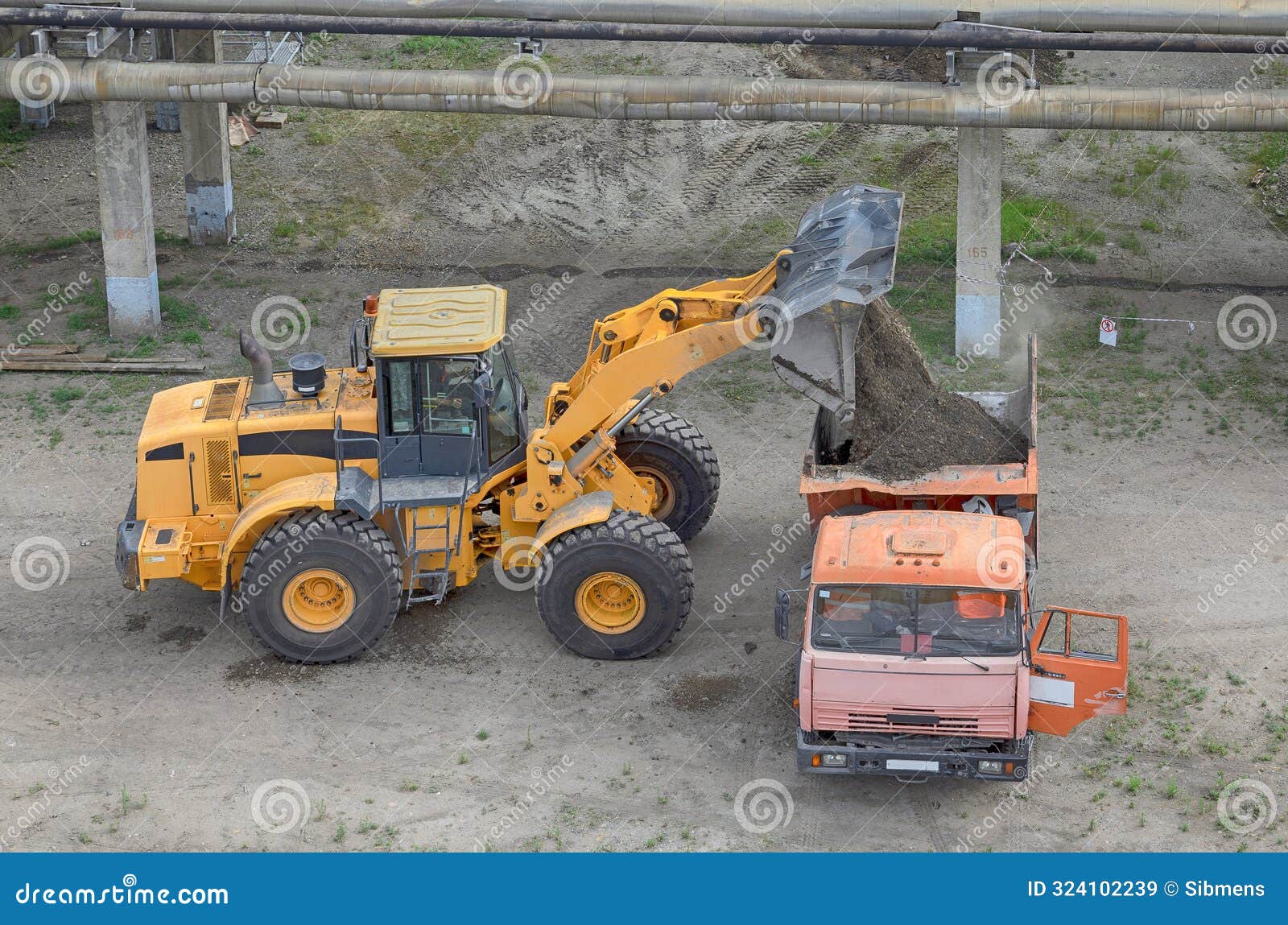 Front Loader Loads Gravel Mixture into a Dump Truck Stock Image - Image ...