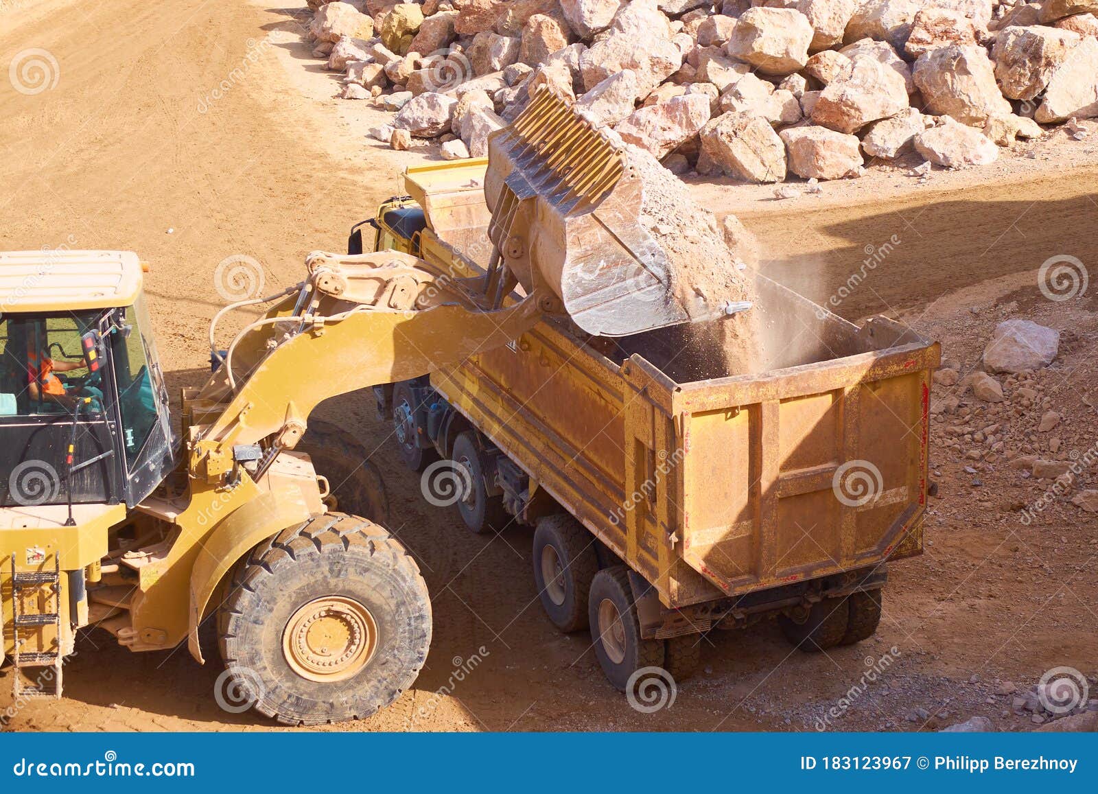 Front Loader Loads Rock into a Dump Truck Stock Image - Image of ...