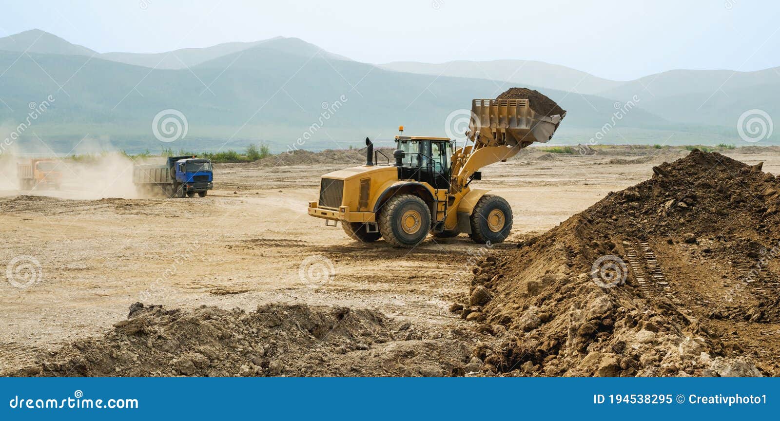 Front loader in operation stock image. Image of magadan - 194538295