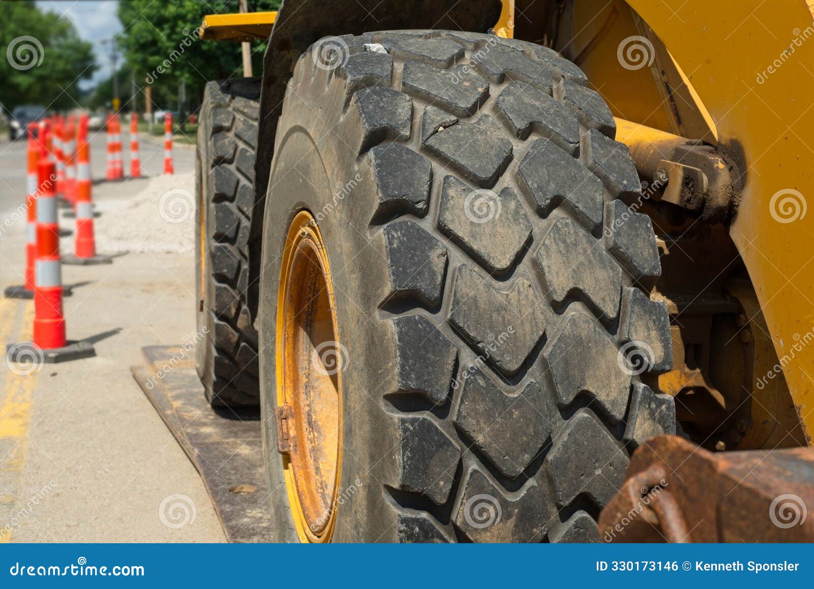 Front Loader Wheels Closeup with Traffic Cones Stock Photo - Image of ...