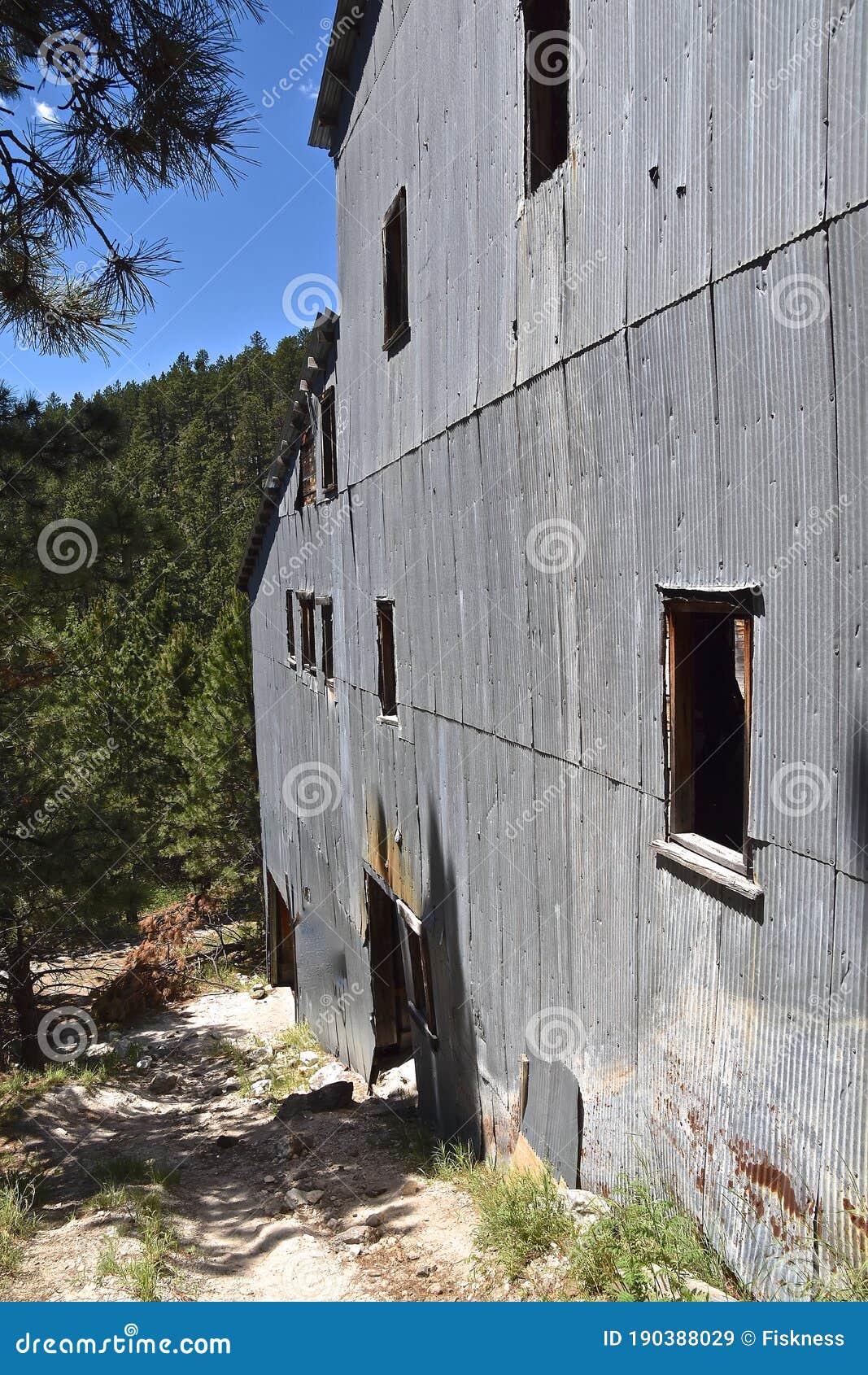 Mining Structure At End Of Road With Large Vertical Mountains In ...