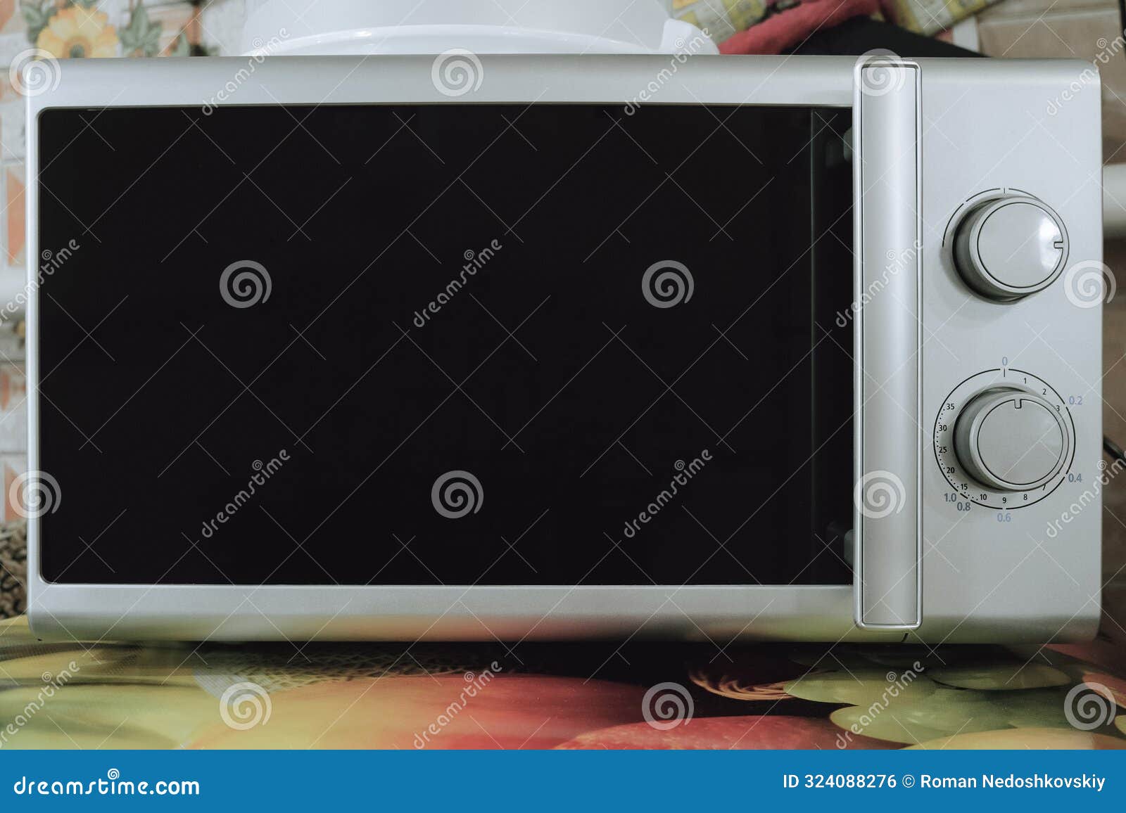 Front Panel of a Microwave Oven with a Handle on the Door Stock Photo ...