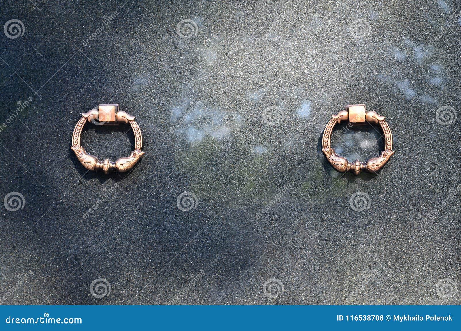 The Front Part of the Granite Crypt with Metal Ring Handles in the ...