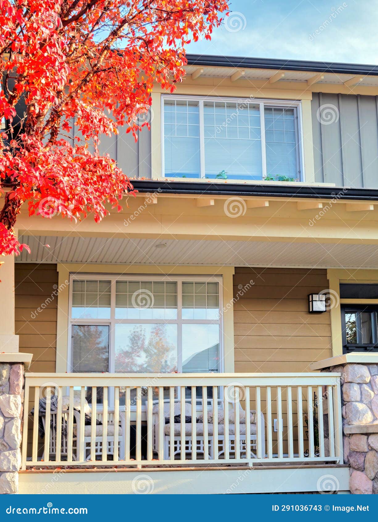 Front Patio and Top Level of Residential House with Red Maple Tree in ...