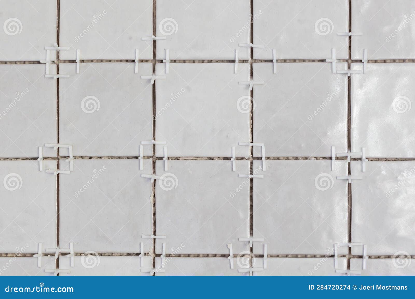 A Front Portrait of a Tile Wall Under Construction. the Wall is Being ...