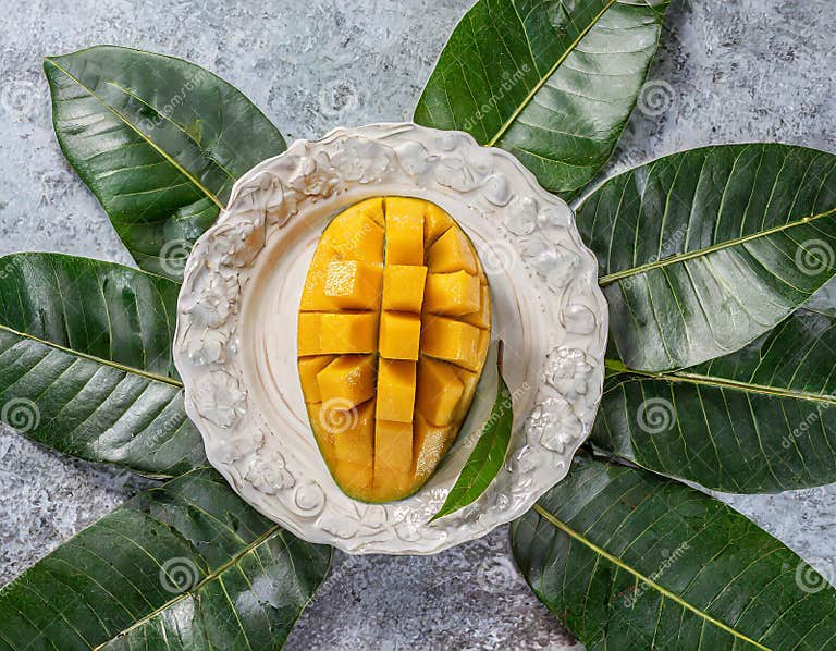 Front Shot of the Inside of the Mango Fruit on a Wooden Kitchen Table ...