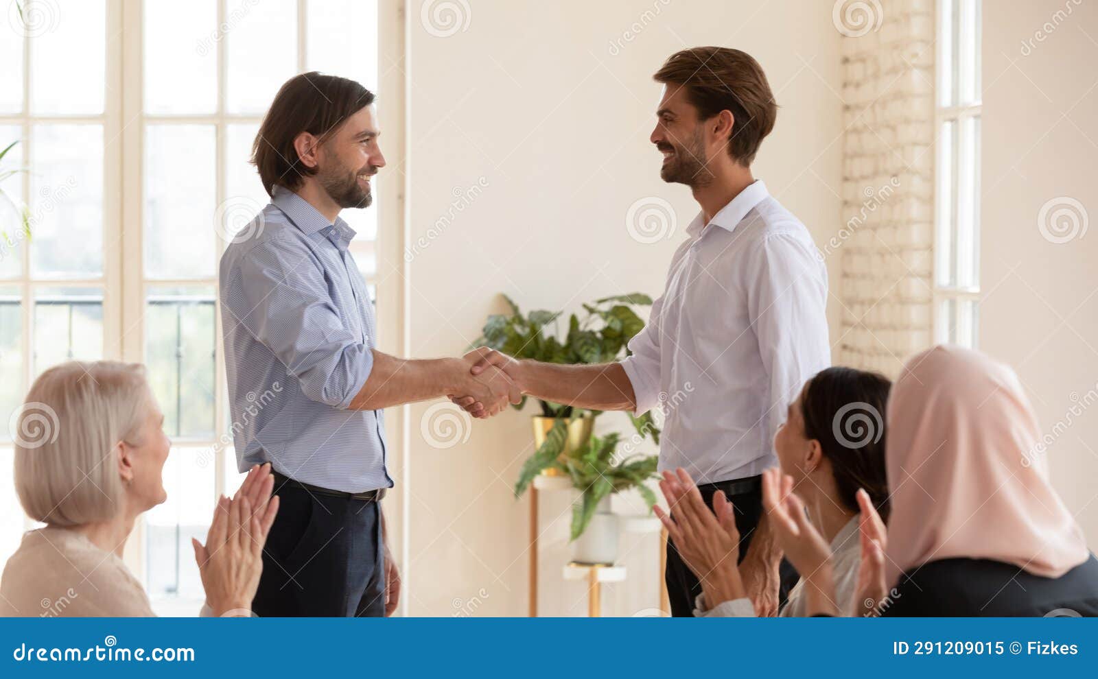 In Front of Staff Two Men Shaking Hands Feels Happy Stock Image - Image ...