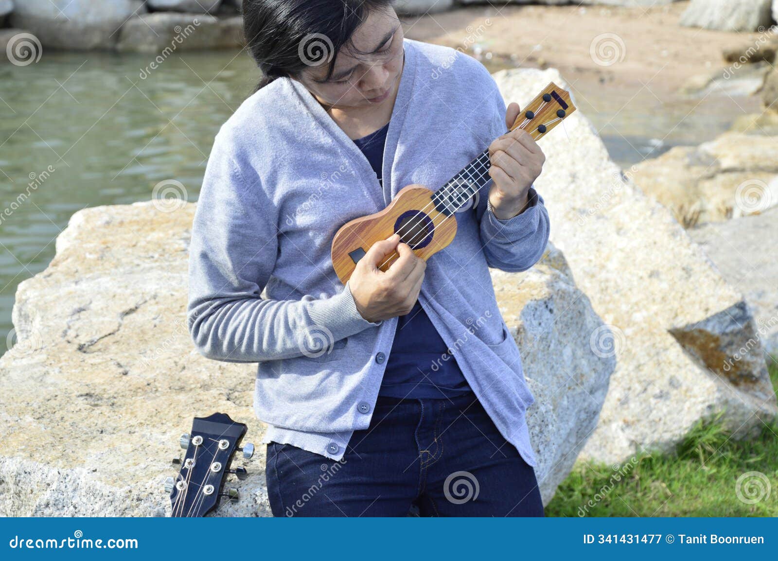 Front View of Asian Woman Playing Ukulele Stock Image - Image of shot ...