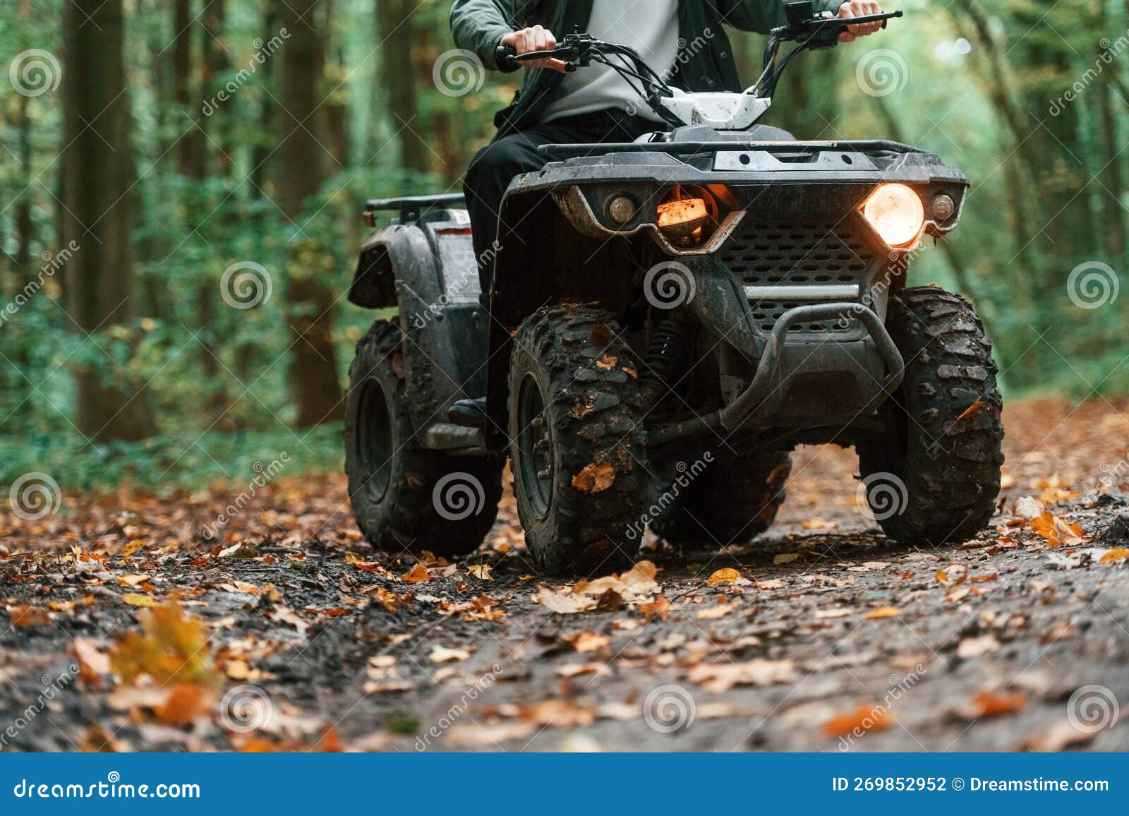 Front View. ATV Driver is in the Forest, Having a Ride at Daytime Stock ...