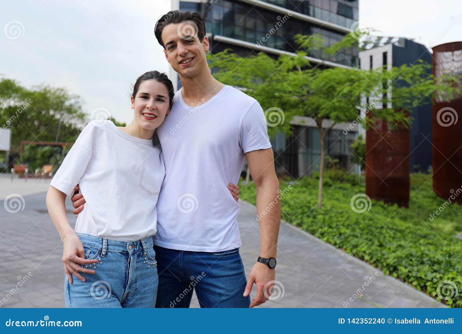 Front View of Beautiful Young Couple Hugging, Looking at Camera and ...