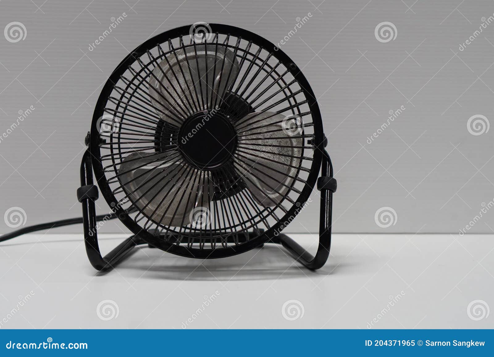Front View Black Small Metal Table Fan on White Floor, White Wall ...