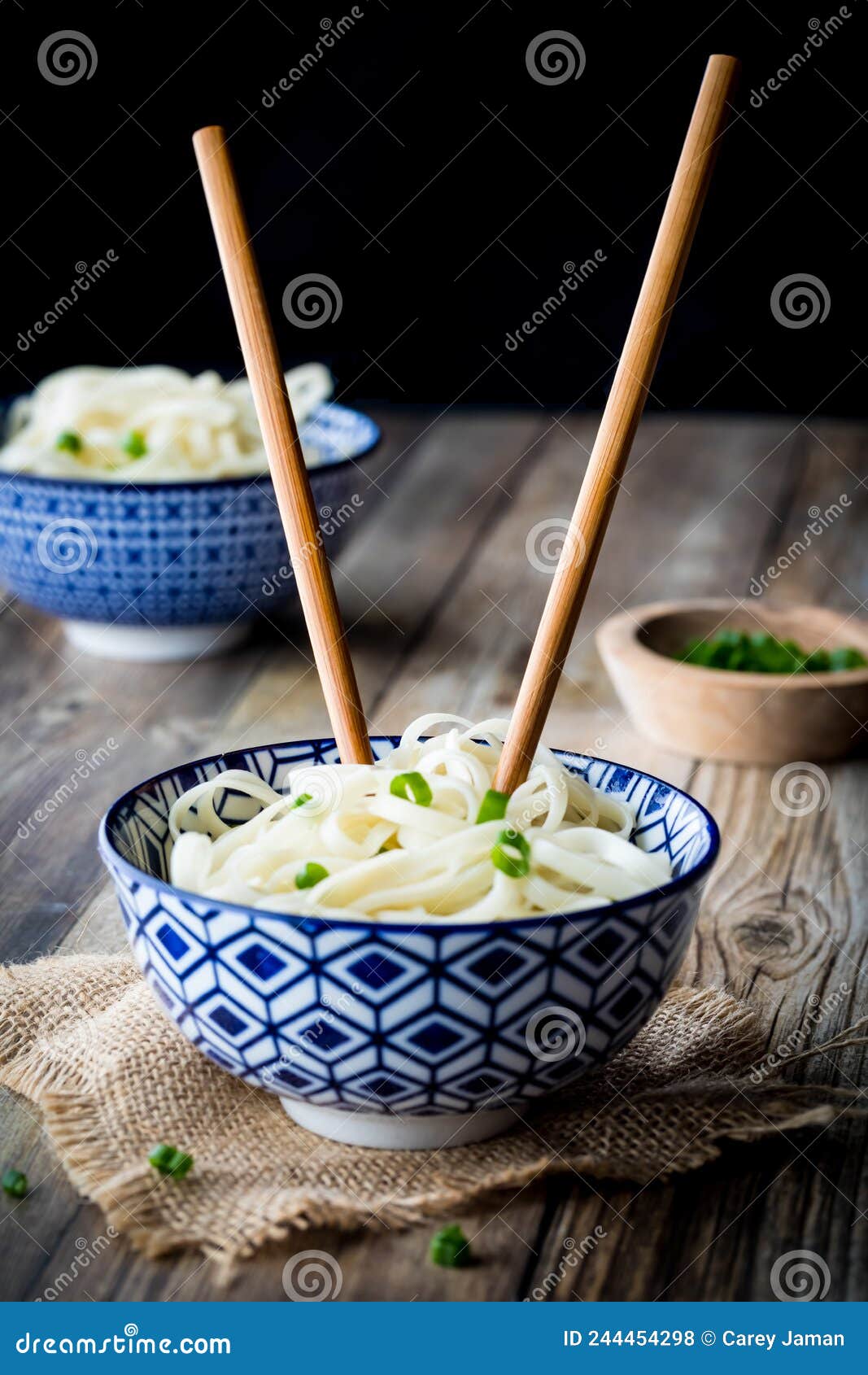 Front View of a Bowl of Noodles with Chopsticks Inserted. Stock Photo ...