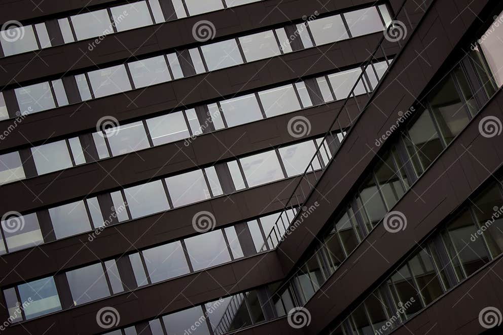 Front View of Brown Office Building with Large Reflective Windows ...