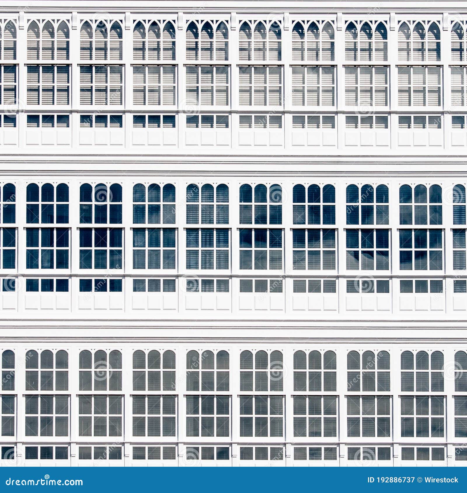 Front View of a Building with Rows of Decorative Windows Stock Image ...