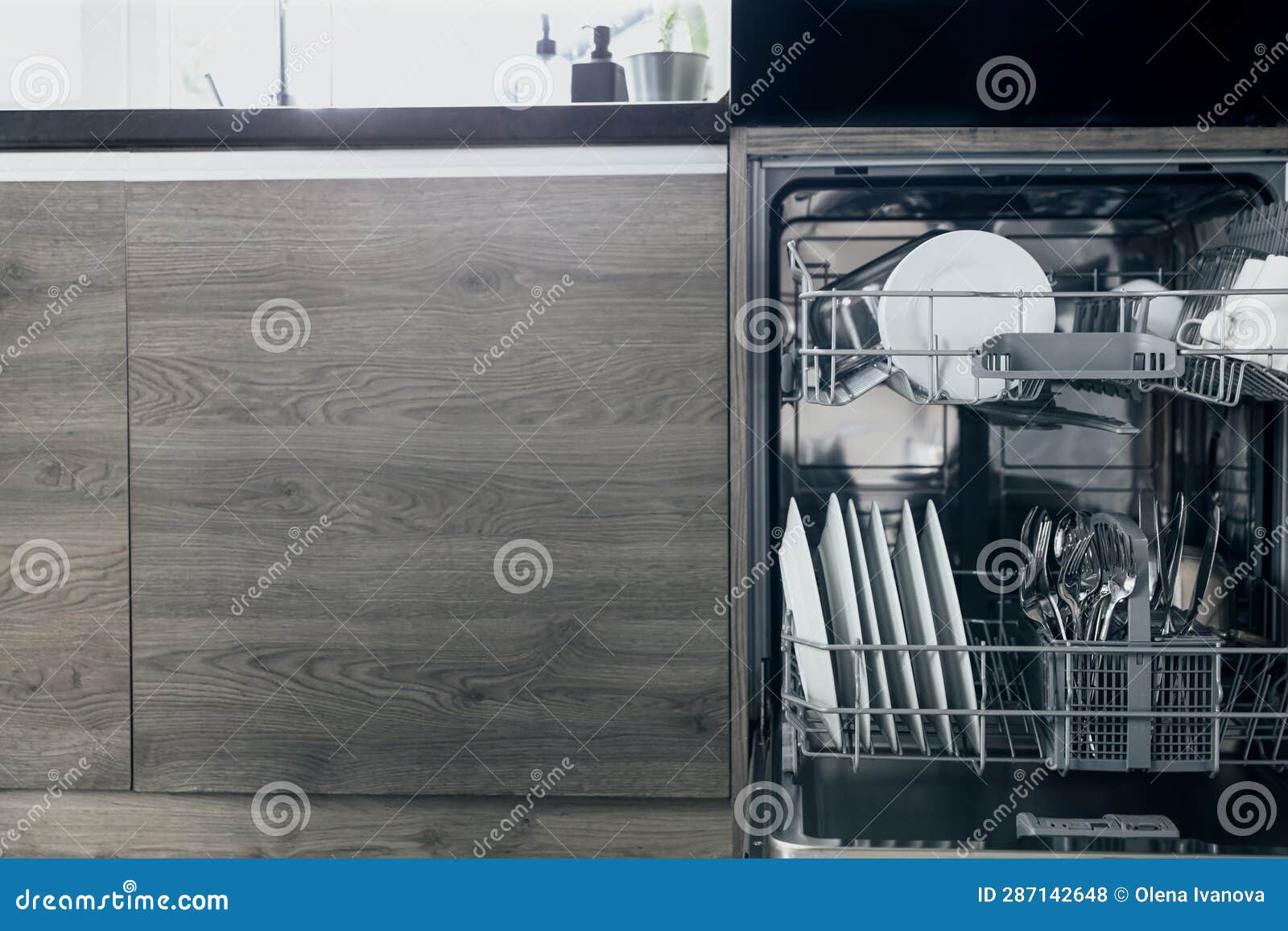 Front View of Built-in Opened Dishwasher Machine at Kitchen with Clean ...