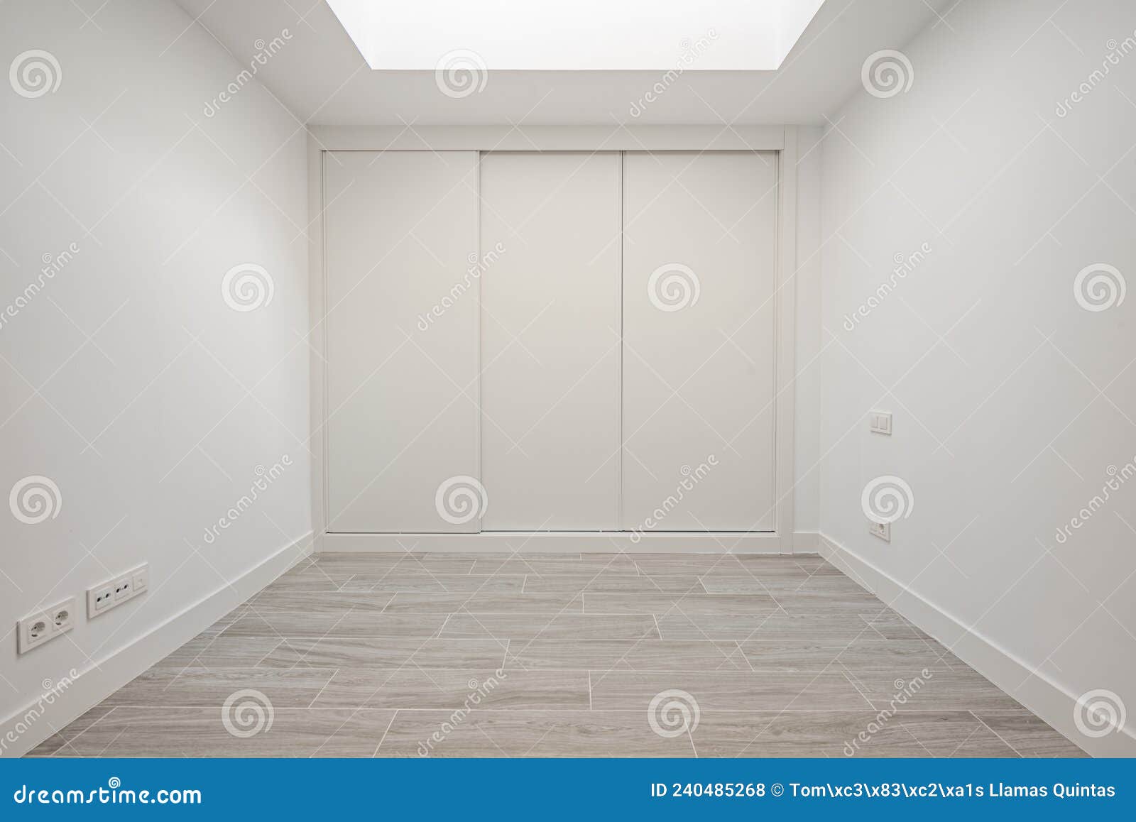 Front View of a Built-in Wardrobe with White Sliding Doors Stock Photo ...