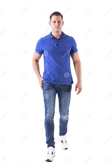 Front View of Confident Young Adult Man Walking Forwards and Looking at ... Front View of Confident Young Adult Man Walking Forwards and Looking at ...