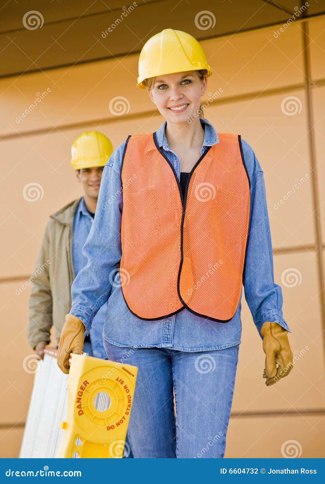 Front View of Construction Workers Carrying Ladder Stock Photo - Image ...