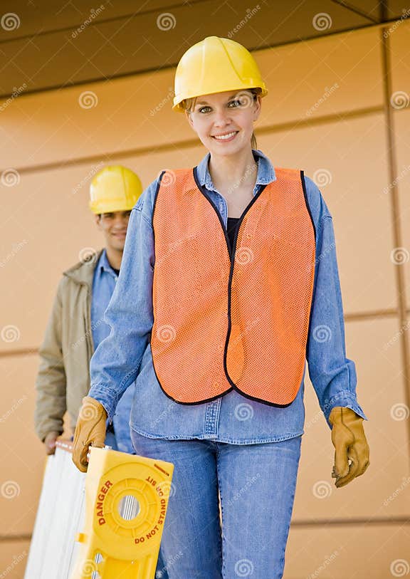 Front View of Construction Workers Carrying Ladder Stock Photo - Image ...