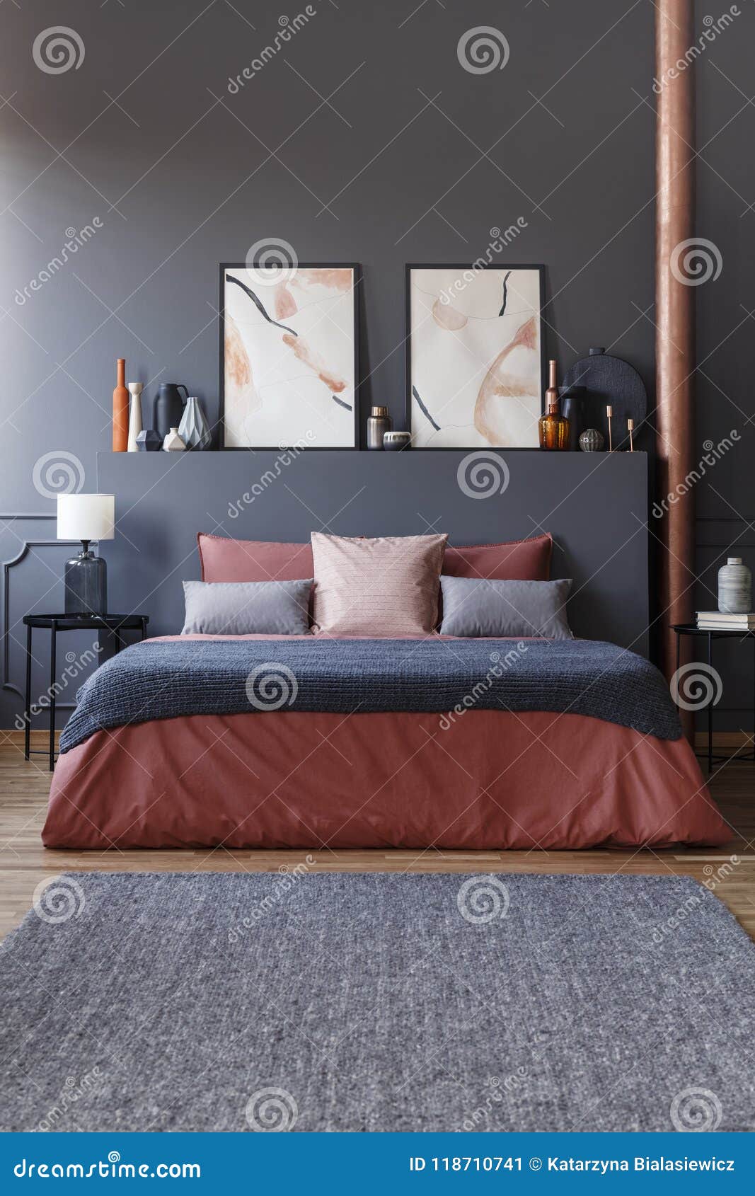 Front View of a Cozy Bed with Ginger Bedding, Gray Blanket and P Stock ...