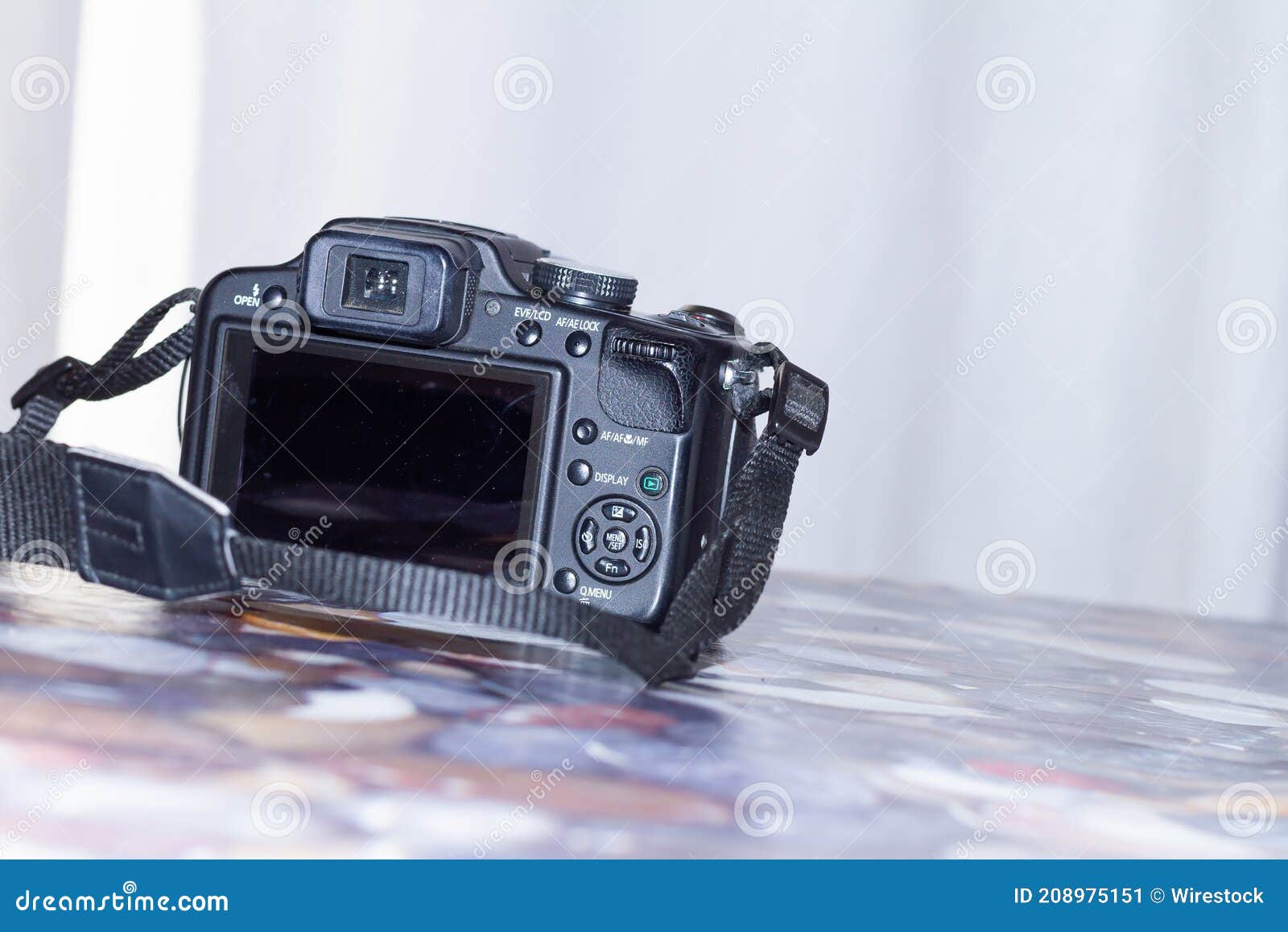 Front View of a Digital Camera on a Table Stock Image - Image of screen ...