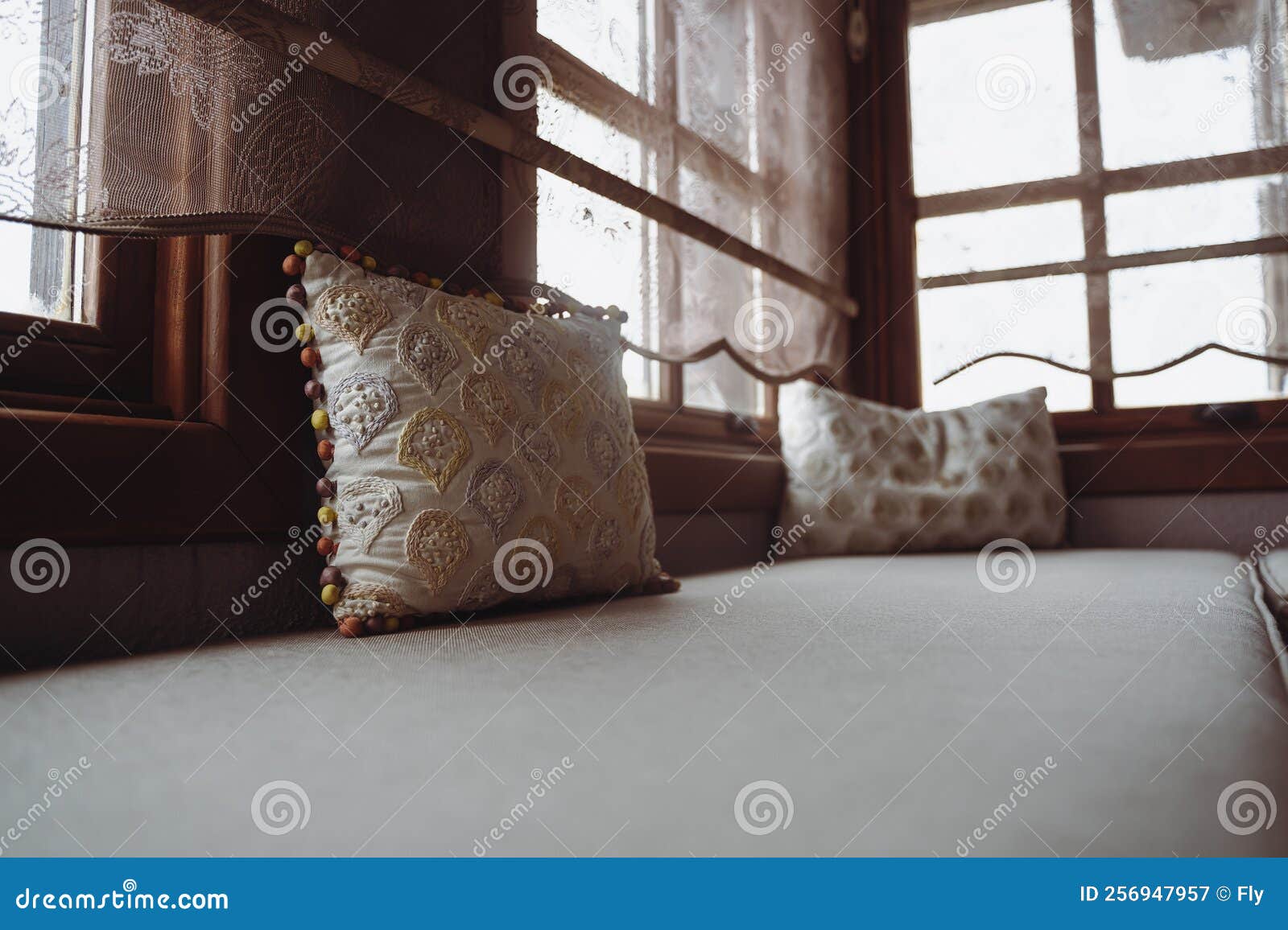 Divan with Several Pillows in Front of Window Stock Image - Image of ...