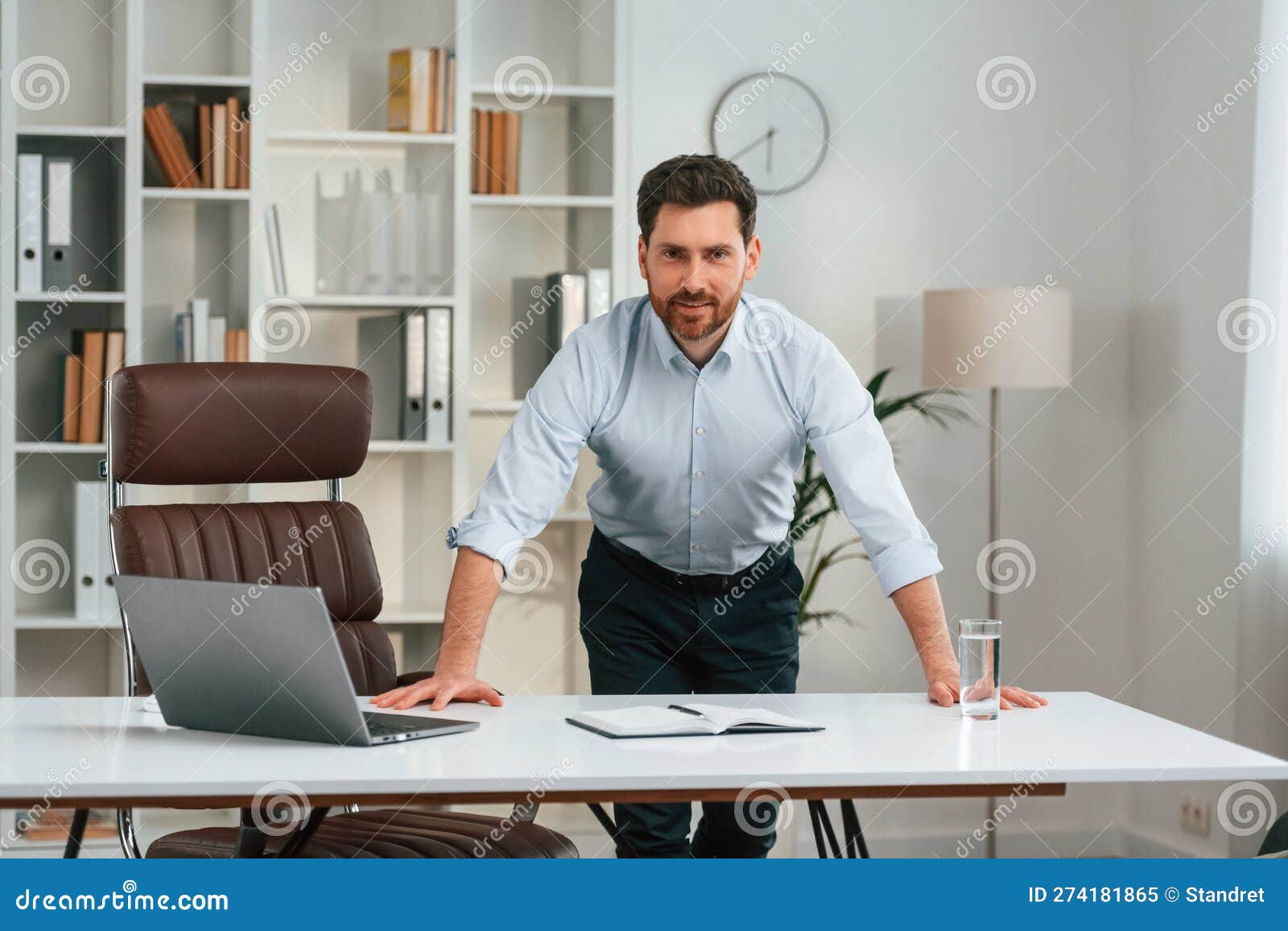 Front View. Doctor in Formal Clothes is Working in the Cabinet Stock ...