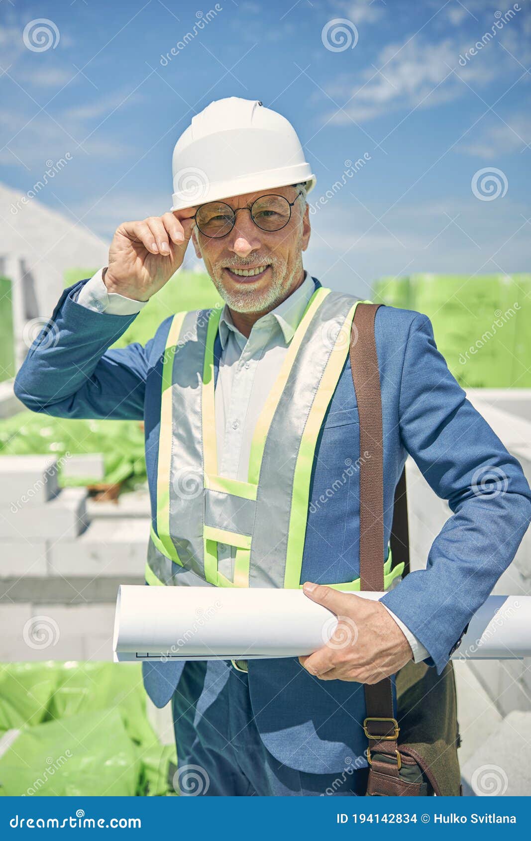 Smiling Engineer Holding Drawings in His Hand Stock Photo - Image of ...