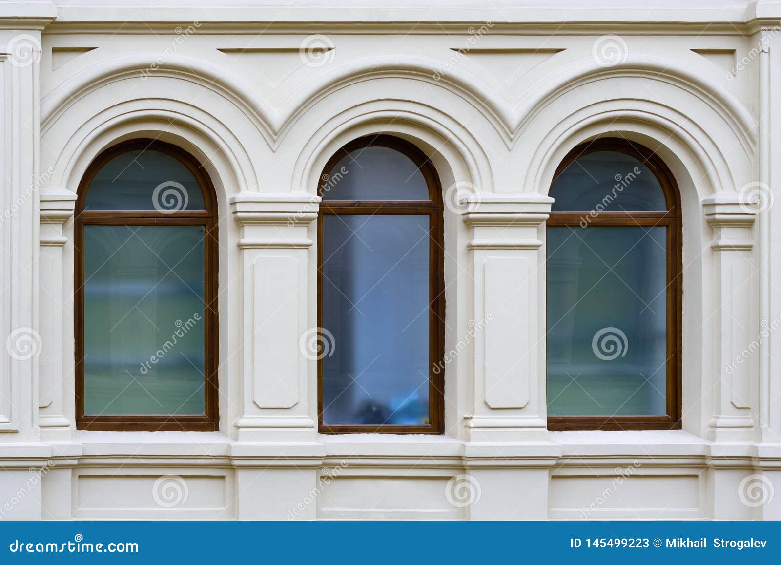 A Facade of Ancient Stone Building with Three Arched Windows with ...