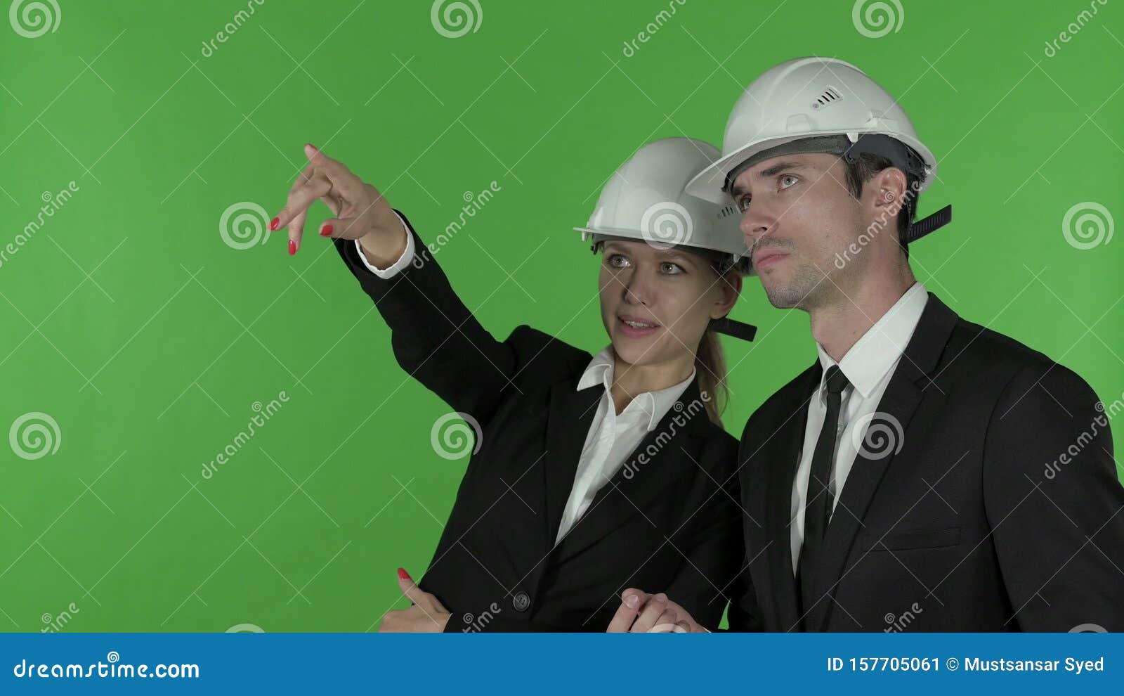 Front View of Female Construction Engineer Pointing Up Standing with ...
