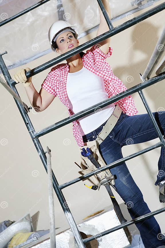 Front View of Female Worker Climbing on Scaffold Stock Image - Image of ...