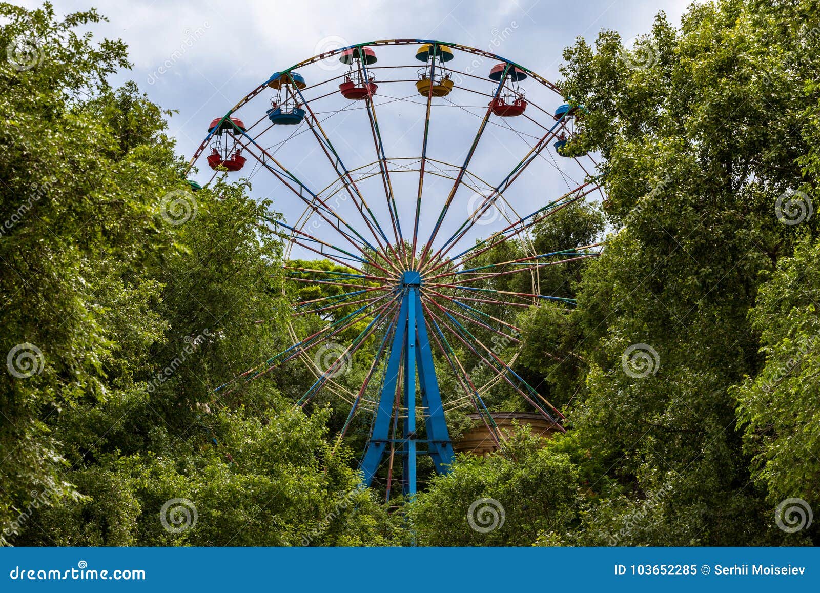Ferris wheel in the trees stock image. Image of carnival - 103652285
