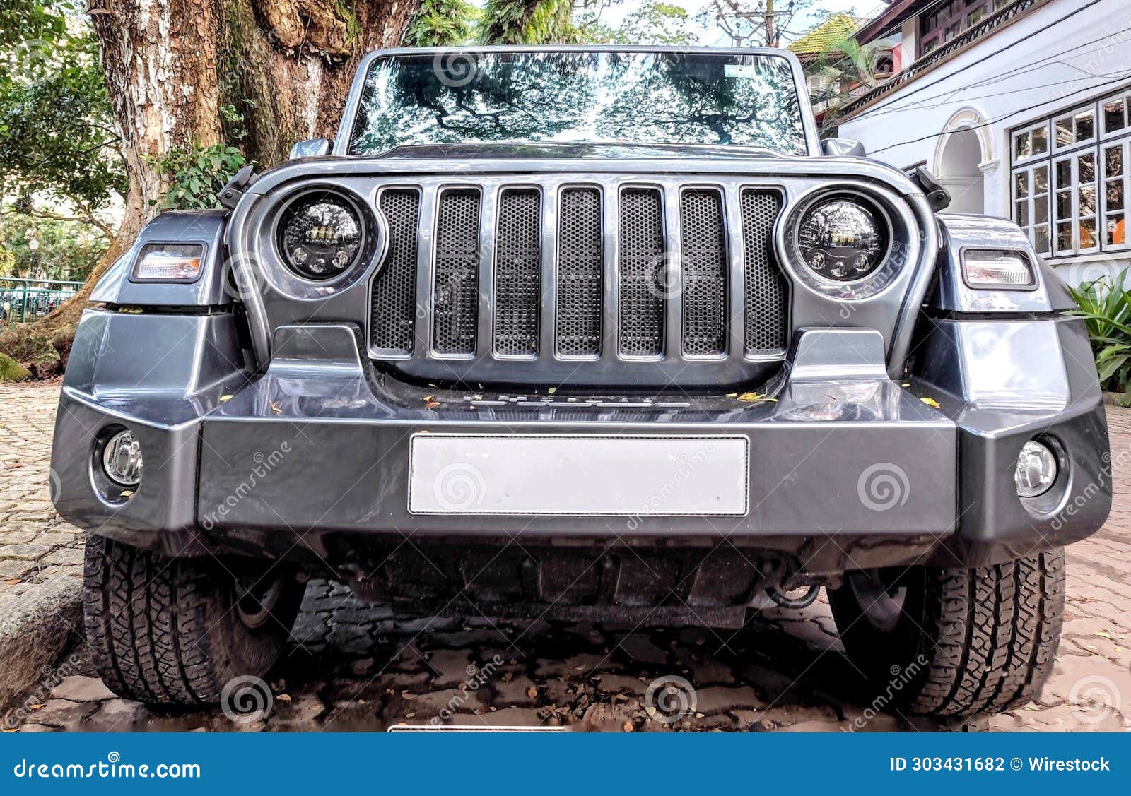 Front View of a Gray Classic 4x4 Car Parked in a Backyard Stock Photo ...