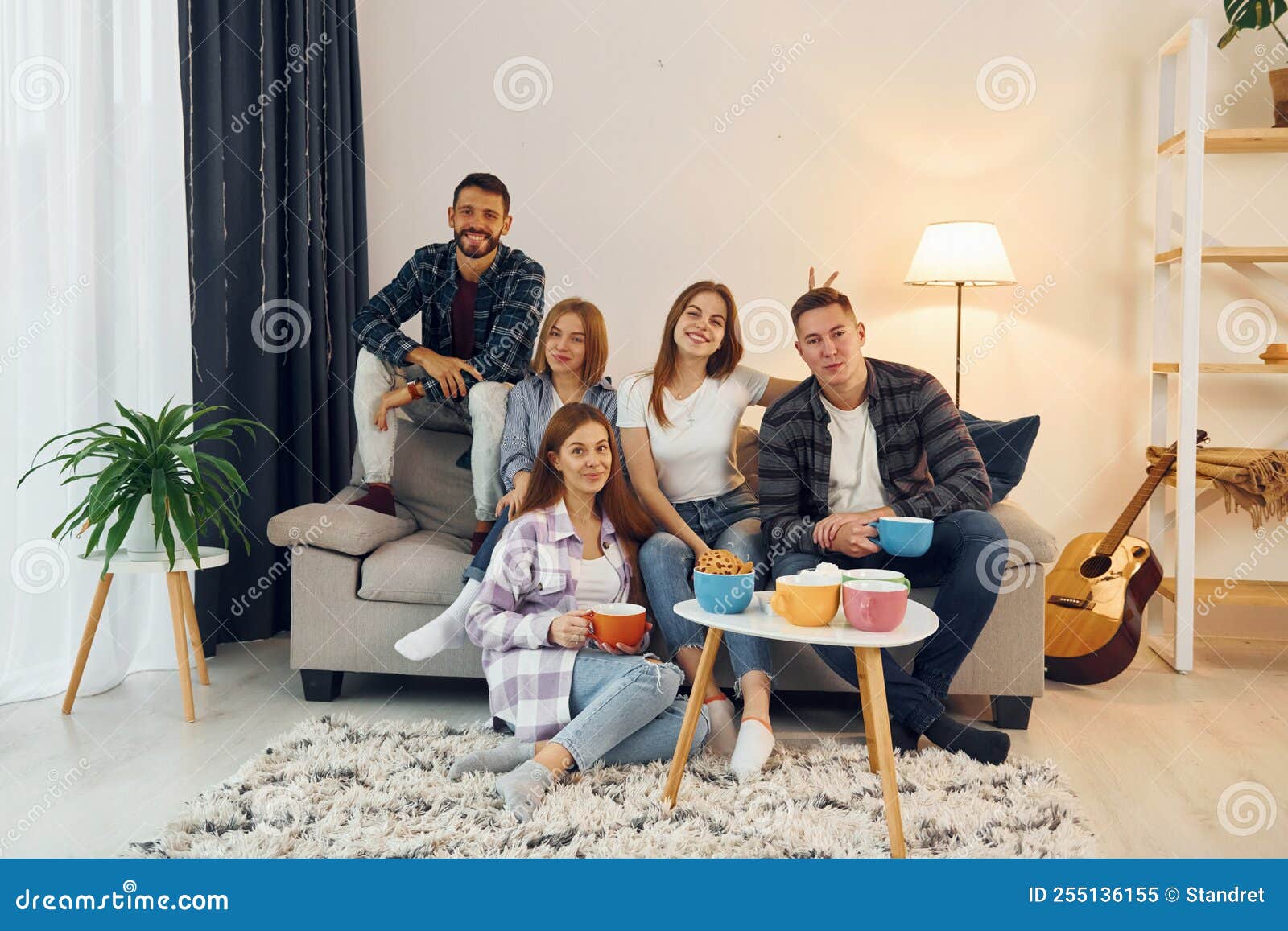 Front View. Group of Friends Have Party Indoors Together Stock Image ...