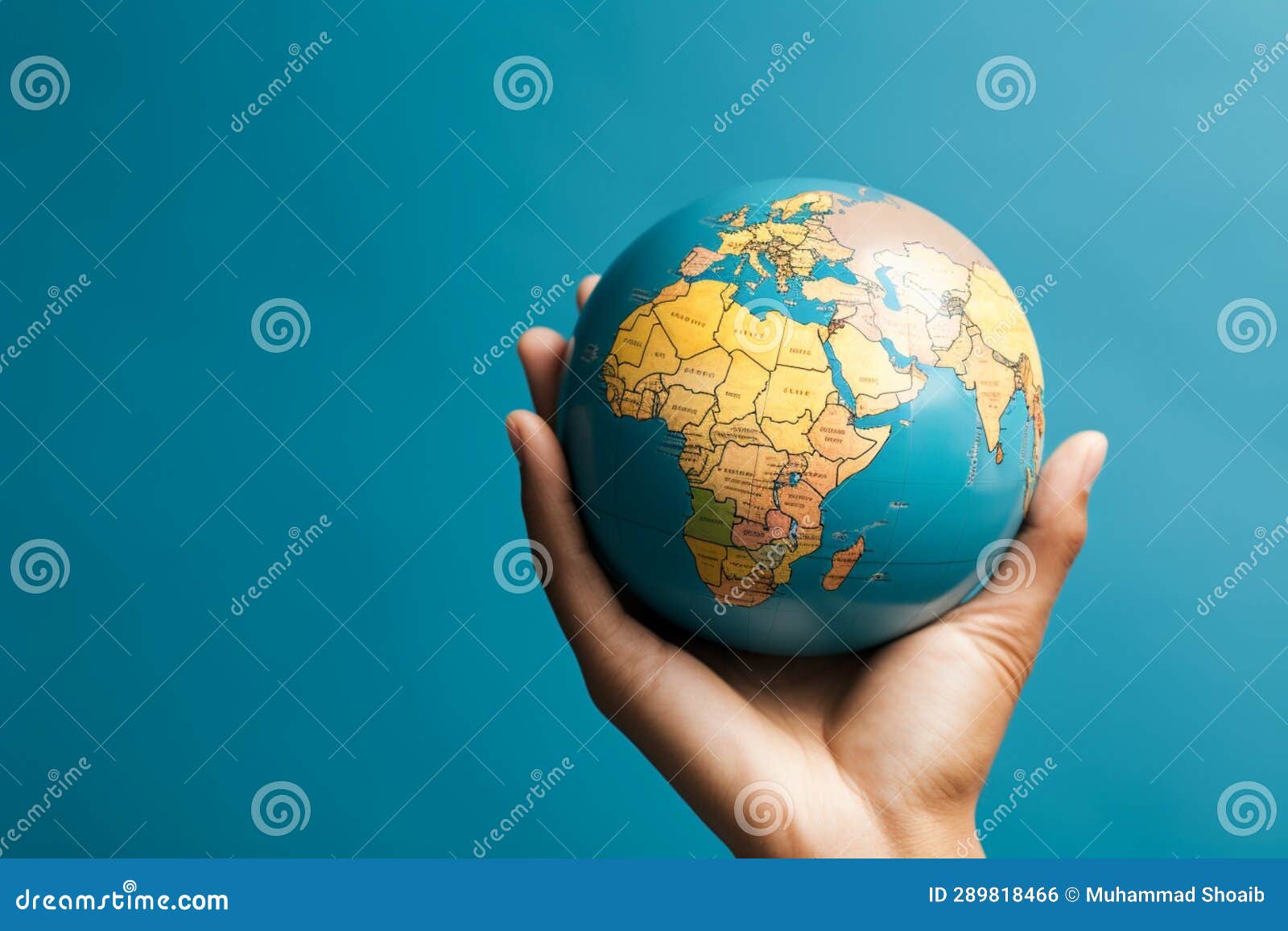 Front View of a Hand Delicately Holding a Globe with Ample Copy Space ...