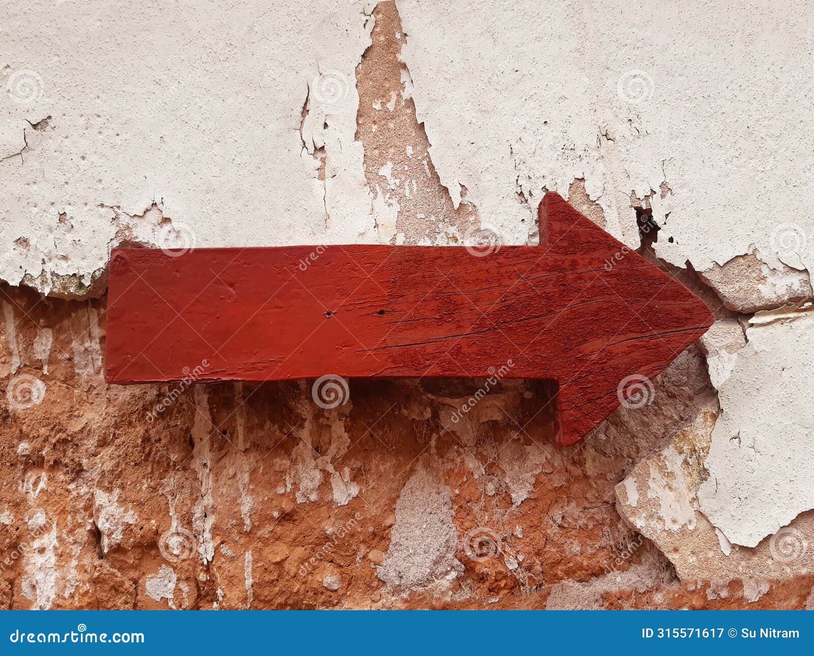 Front View of Indicator Arrow on Uncorked Cement Wall. Signage and ...