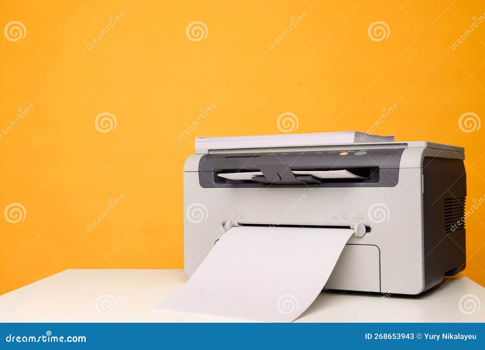 Front View of a Printer and a Blank Sheet of A4 Paper on a White Table ...