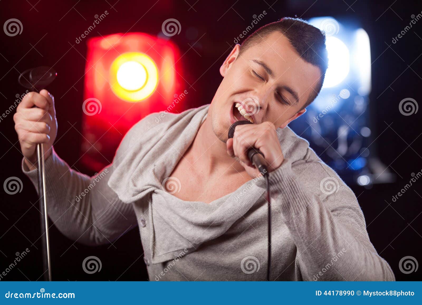 Front View of Male Singer Holding Stand. Stock Photo - Image of closeup ...