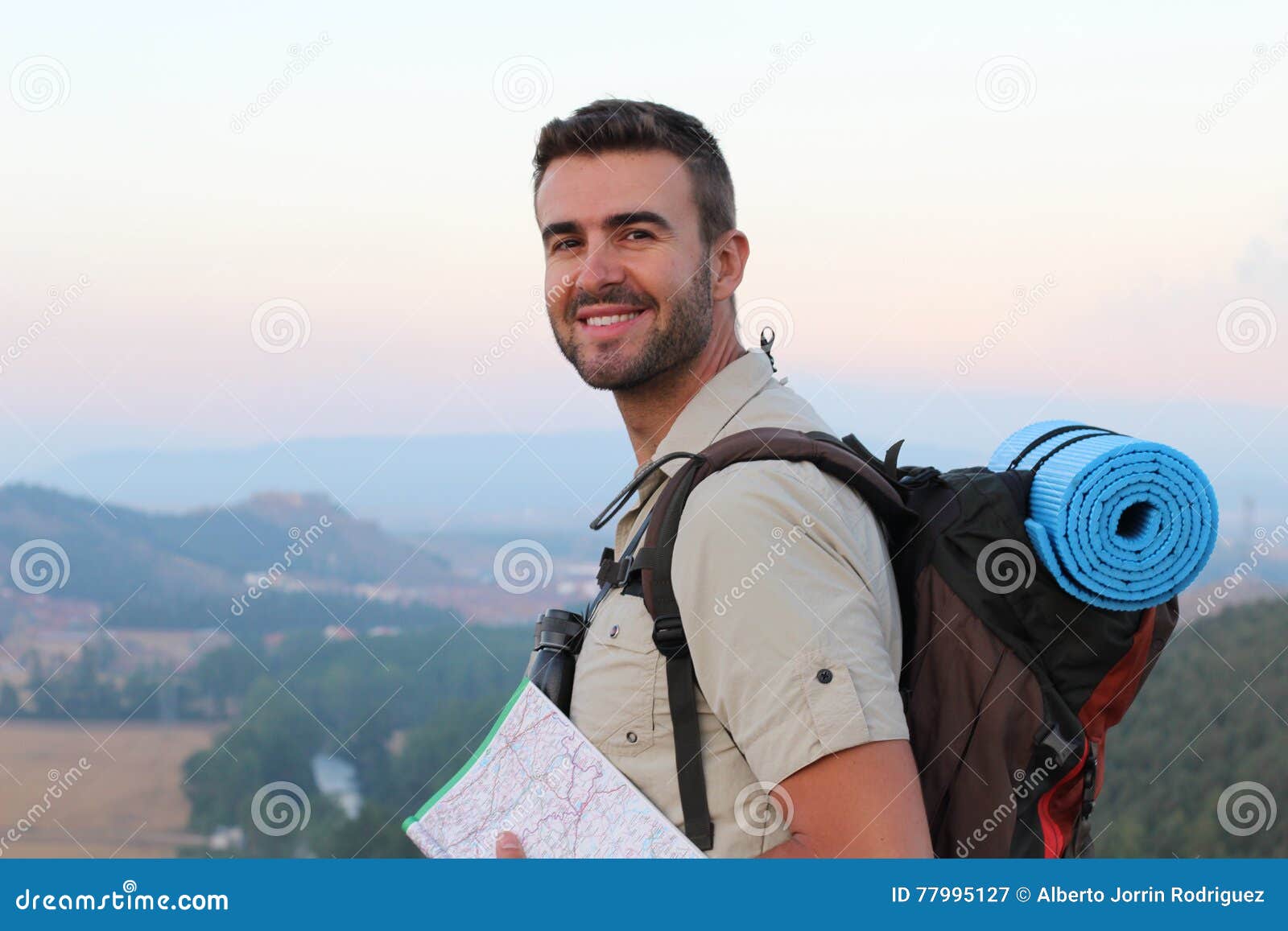 Front View of Man with Backpack Hiking in the Top of the Mountains ...