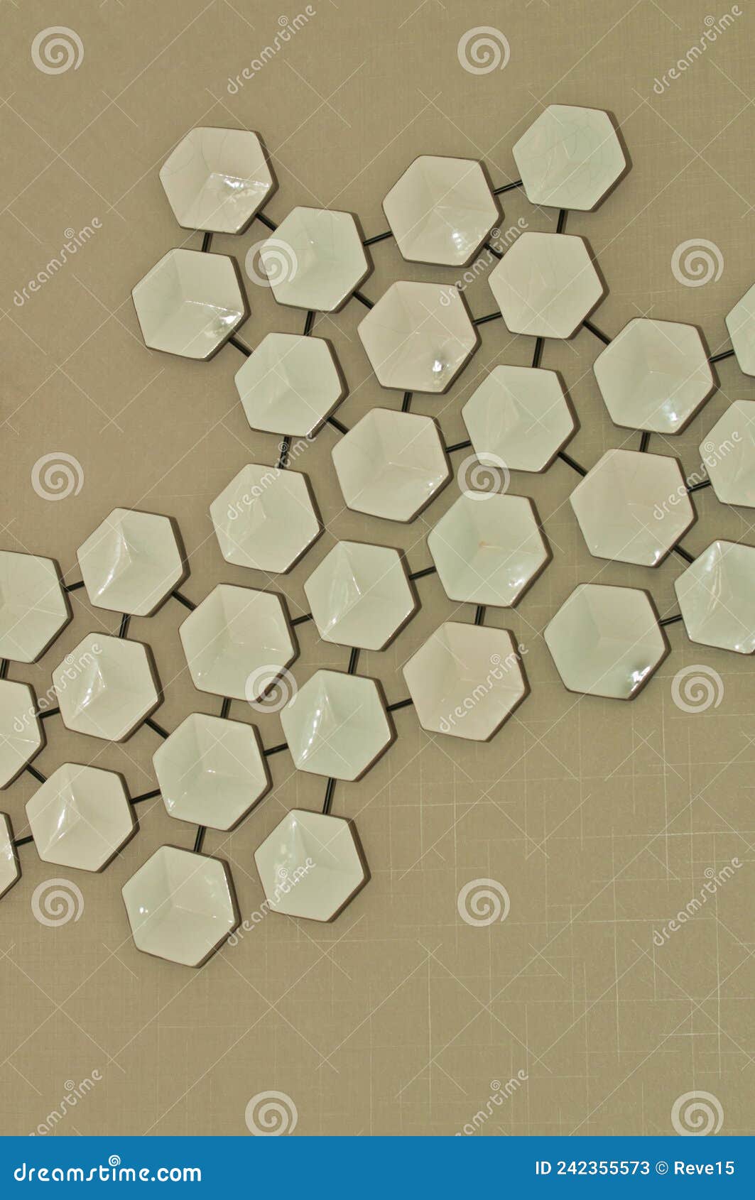 Tan Ceramic Five Sided Objects Connected by Black Rods Stock Image ...
