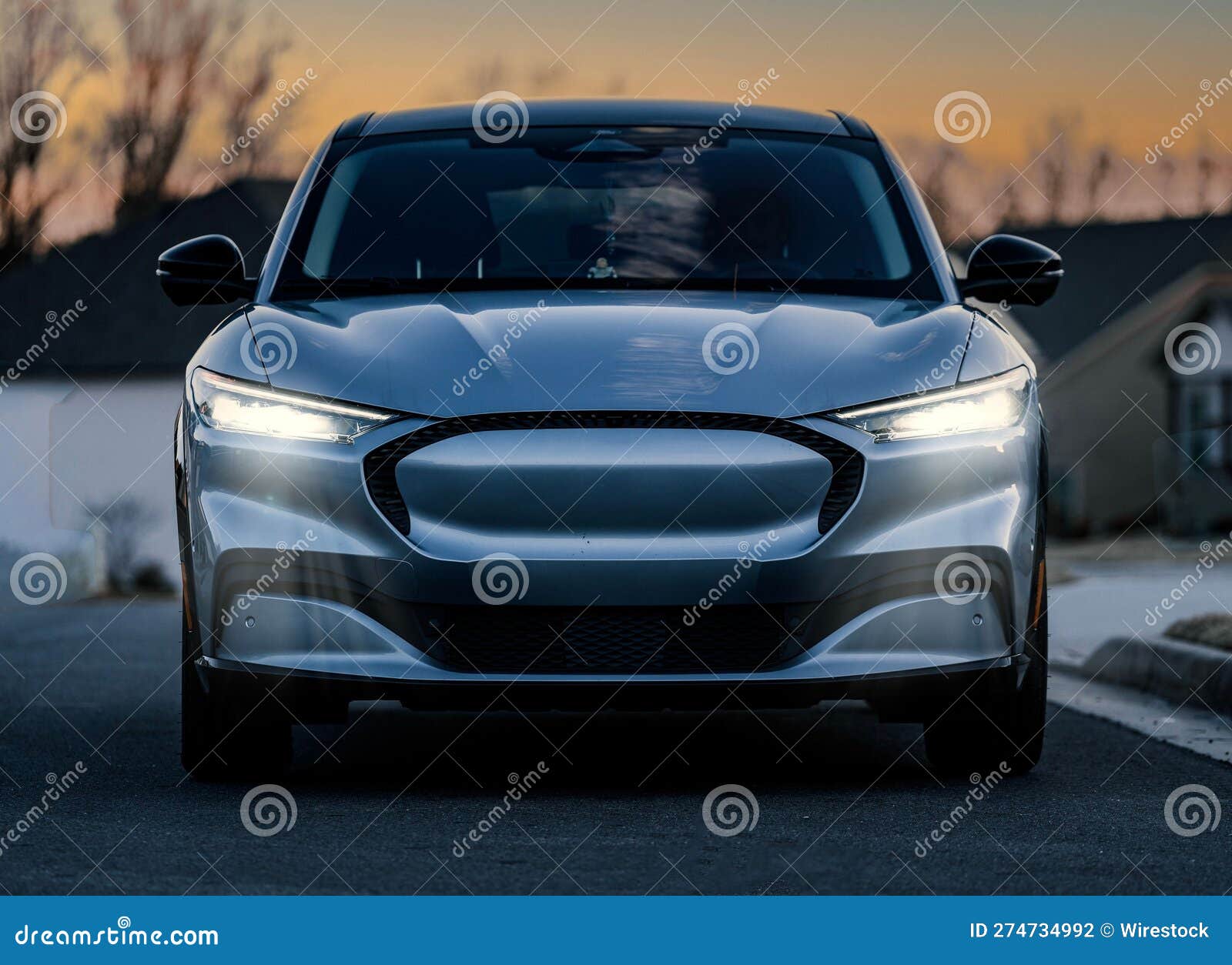 Front View of a Modern Electric Vehicle at Sunset. Stock Photo - Image ...