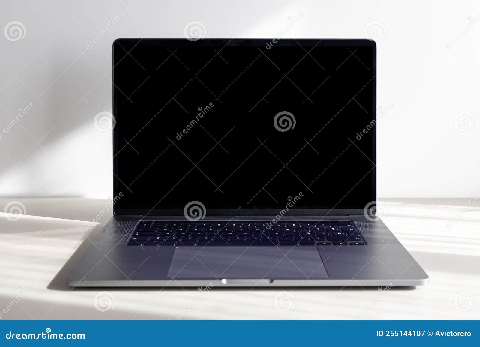Front View of Modern Laptop with Empty Black Screen on Minimalist Desk ...